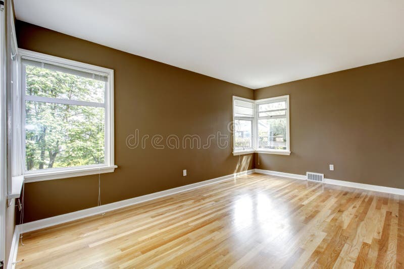 Empty Room with Brown Walls and Hardwood Floor. Stock Image - Image of ...
