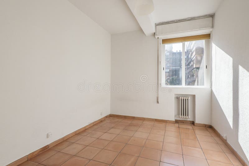 Empty Room with Cast Iron Radiator in Wall Niche Under Aluminum Window ...