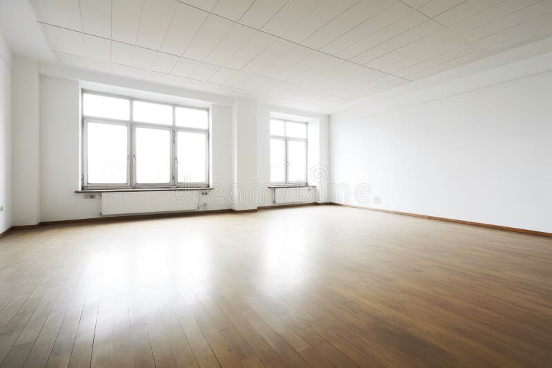 Empty Room with Hard Wood Flooring and Radiator in the Corner ...