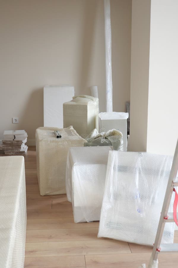 An Empty Room with Hardwood Flooring and Wrapped in Plastic. Stock ...