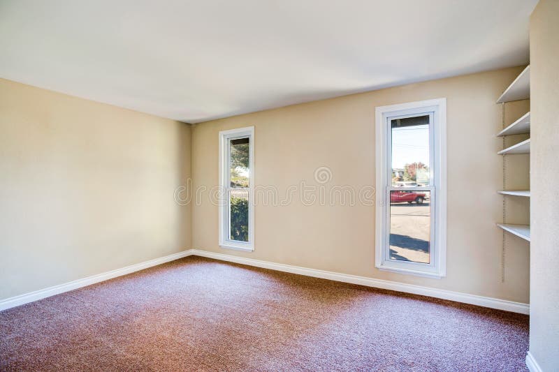 Empty Room Interior with Brown Carpet and Light Beige Walls Stock Image ...