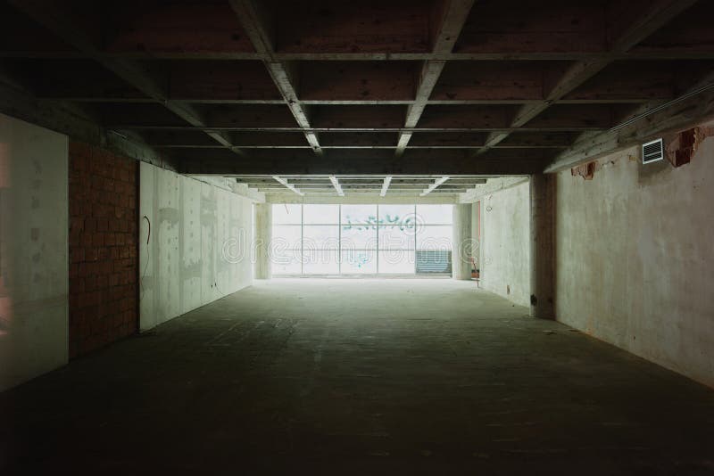 A Empty Room with Windows and Lights Shining through the Gap Stock ...