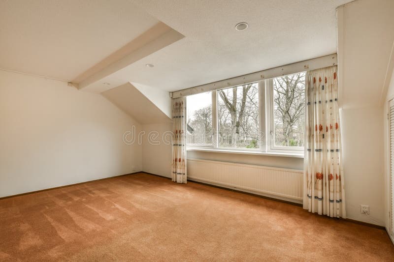 An Empty Bedroom with a Large Window and Curtains Stock Image - Image ...
