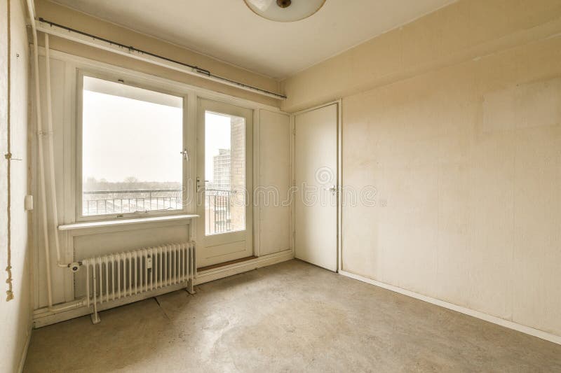 An Empty Room with a Radiator and a Window Stock Image - Image of ...