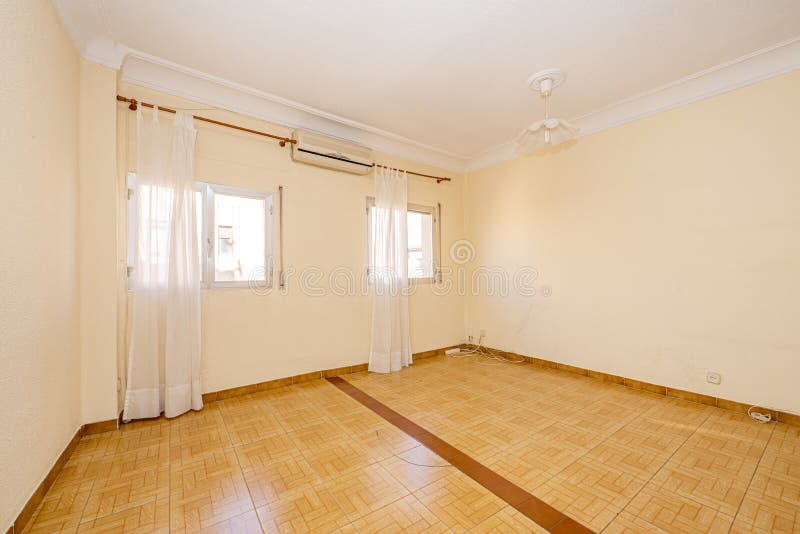 Empty Room with Two Twin Windows with White Curtains and Tiled Floors ...