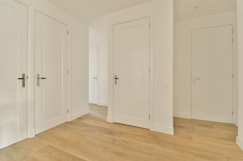 A Bedroom with Three Doors and a Wood Floor Stock Image - Image of ...