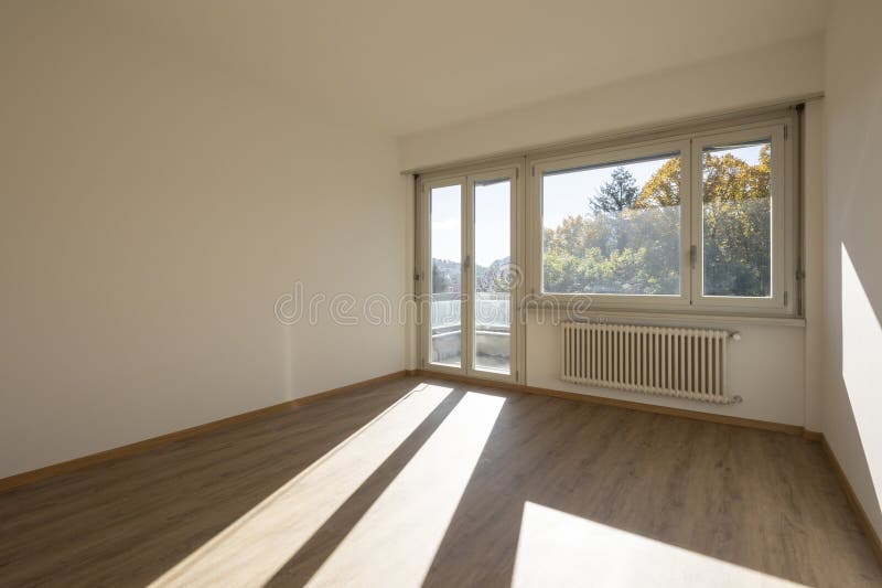 Empty Room with White Walls and a Large, Bright Window that Lets in ...