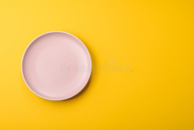 Empty Round Ceramic Plate on Yellow Background. Food Background Stock ...