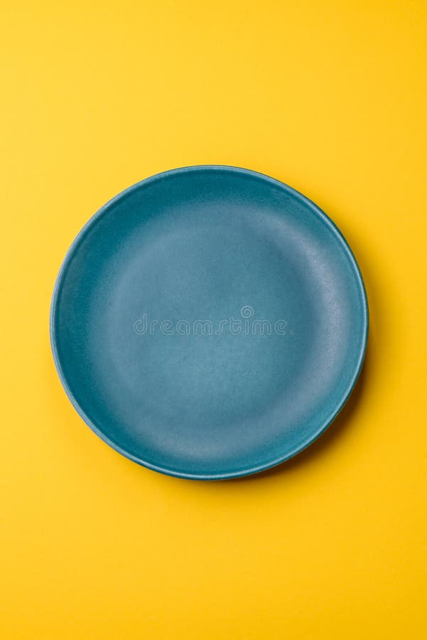 Empty Round Ceramic Plate on Yellow Background. Food Background Stock ...