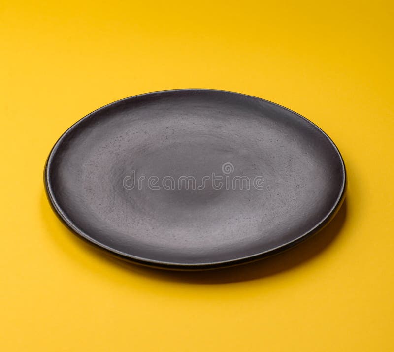 Empty Round Ceramic Plate on Yellow Background. Food Background Stock ...