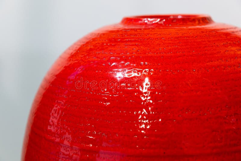 An Empty Round Red Vase Stands in Front of White Wall, Close Up Stock ...