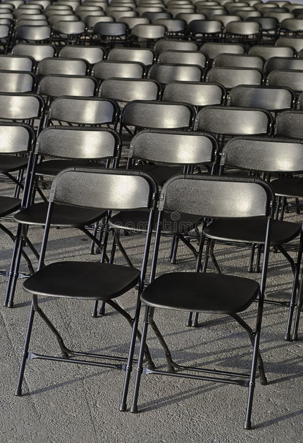 Empty Rows of Black Plastic Chairs Stock Photo - Image of listening ...