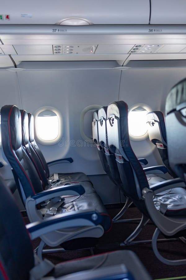Empty Rows of Black Seats Inside Airplane Stock Photo - Image of belts ...