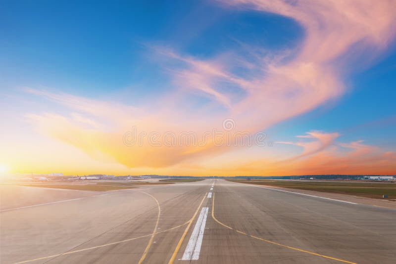 Empty Runway Airport Flight Field and Clouds at Sunset Stock Image ...