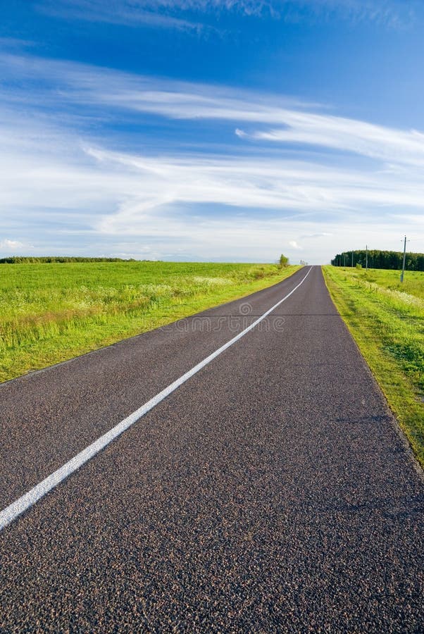 Empty Rural Road Going through Prairie Under Cloudy Sky Stock Photo ...