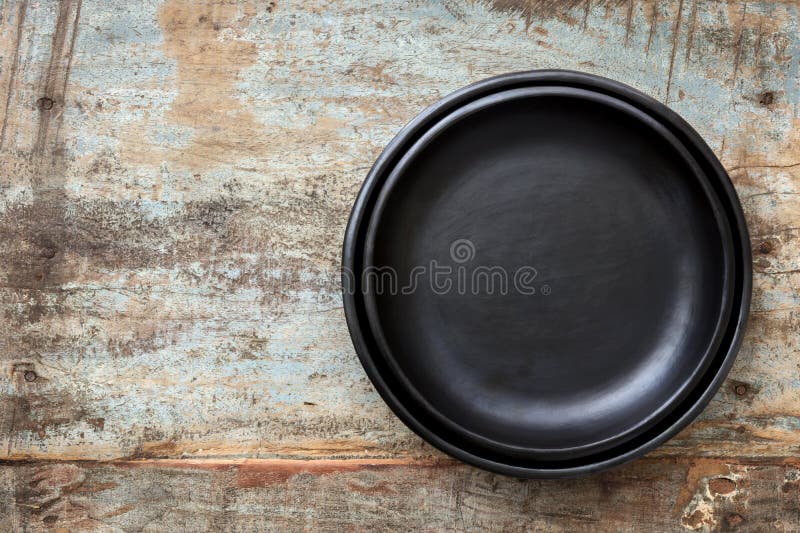 Empty Rustic Black Plates Over Grunge Timber Top View Stock Photo ...