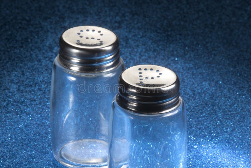 Empty Salt and Pepper Bottles on Blue Stock Image - Image of isolated ...