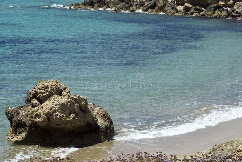 Sandy Beach, Big Rock and Multi Colored Sea Water Stock Image - Image ...