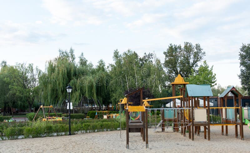 Empty Sandy Playground with Modern Wooden Play Structures, Bridges, and ...