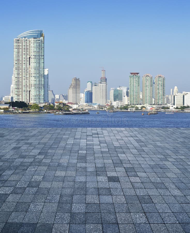 An Empty Scene of a Stone Tile Floor with City Tower Stock Photo ...