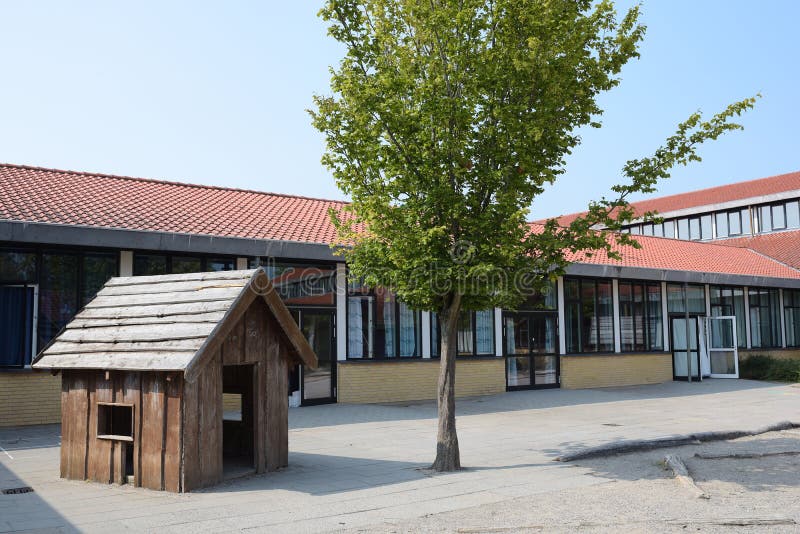 A Empty School Yard with a Playhouse and Tree Stock Image - Image of ...