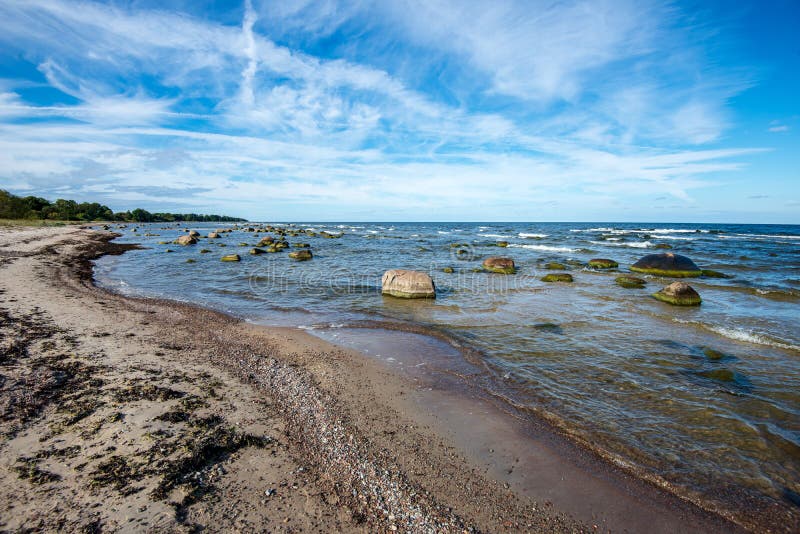 Empty Sea Beach with Rocks and Grass Stock Image - Image of weather ...