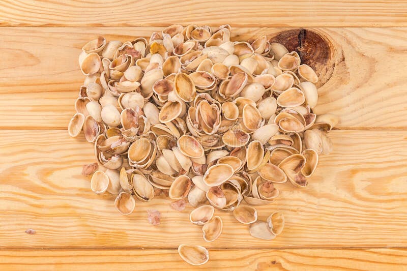 Empty Shells from Peeled Pistachio Nuts on a Rustic Table Stock Image ...