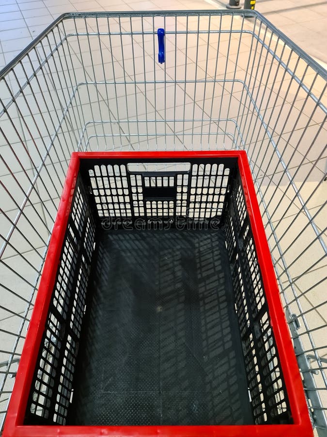 Empty Shopping Cart with Red Plastic Crate Inside a Supermarket Stock ...