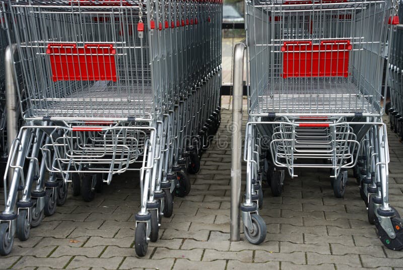 Empty Shopping Carts in Row Outside a Supermarket Stock Image - Image ...