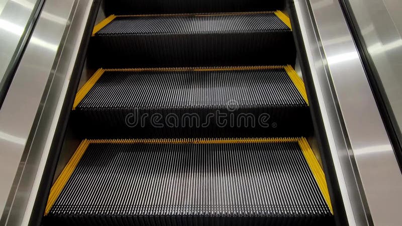 Empty Shopping Mall with Yellow Escalator and Modern Architecture Stock ...