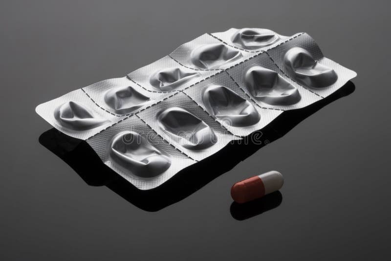 Empty Silver Blister Next To a White and Red Capsule, Conceptual Image ...