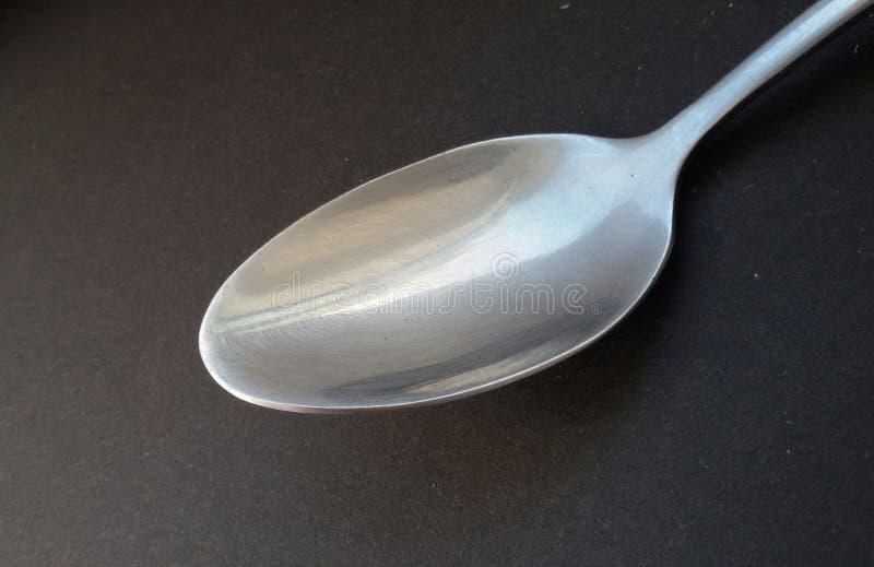 Empty Silver Spoon Over Dark Background. Stock Photo - Image of spoon ...