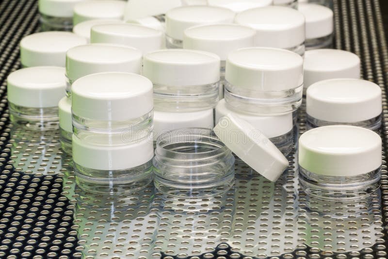 Empty Skin Cans with White Caps Stock Photo - Image of cans, caps: 47469006