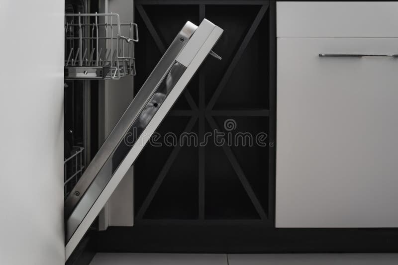 An Empty, Slightly Open Dishwasher Reveals a Clean, Spacious Interior ...