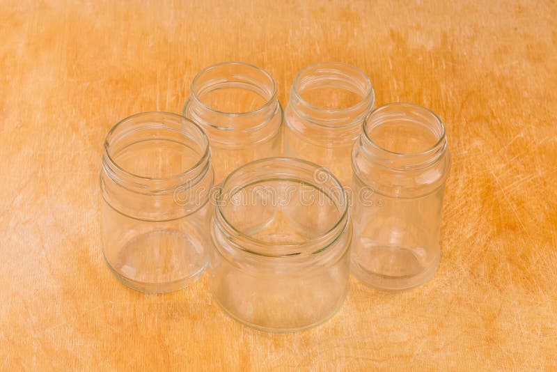 Empty Small Glass Jars Different Sizes on a Wooden Surface Stock Image ...