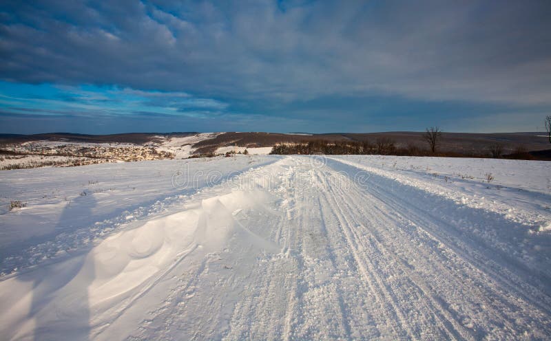 Empty snow covered road stock image. Image of outdoor - 162726845