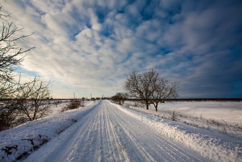 Empty snow covered road stock photo. Image of outdoor - 162726920