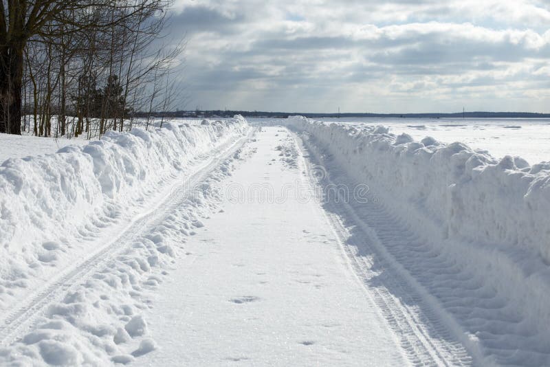 Empty Snow Covered Road in Winter Landscape Stock Photo - Image of ...