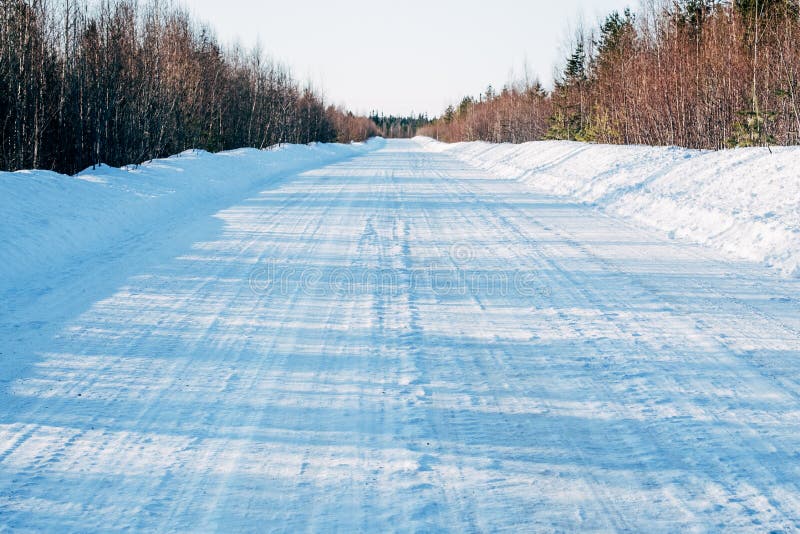 Empty snow covered road stock photo. Image of cold, blue - 116101414