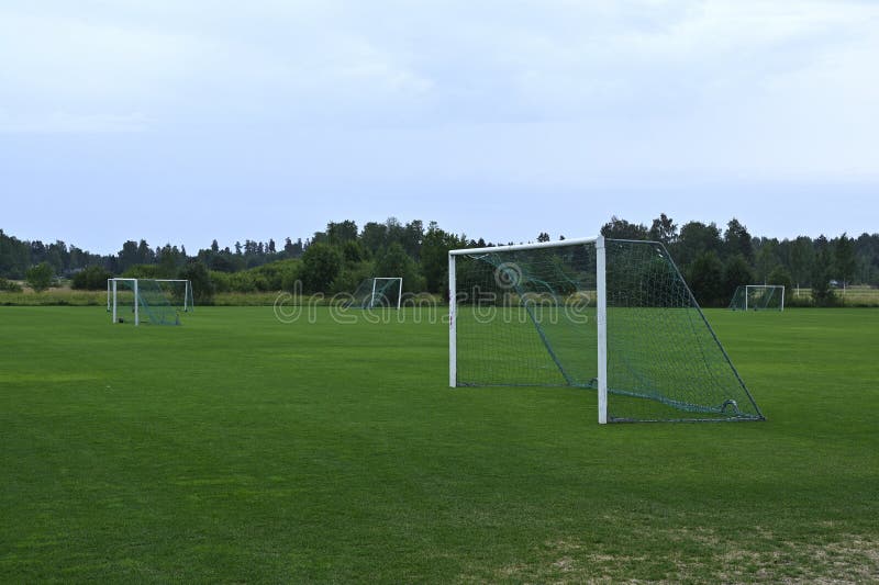 An Empty Soccer Field with Multiple Goalposts Set Against Stock Image ...