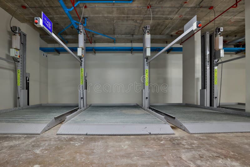 Empty Space in Automatic Elevator Double Stack Car Park. Hydraulic Lift ...