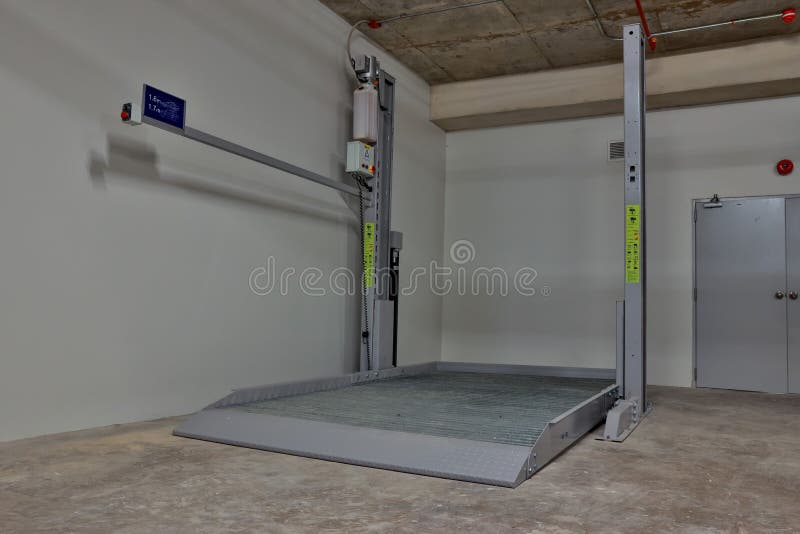 Empty Space in Automatic Elevator Double Stack Car Park. Hydraulic Lift ...