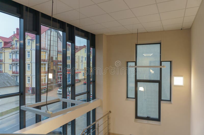 An Empty Space with Railings and Large Windows. the Modern Interior of ...