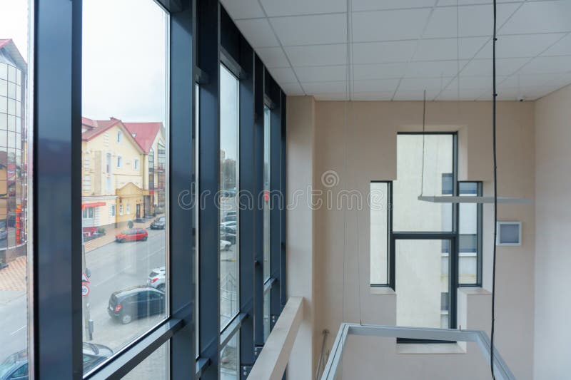 An Empty Space with Railings and Large Windows. the Modern Interior of ...