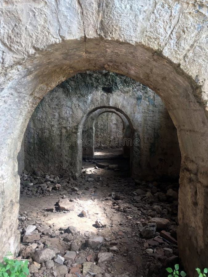 Ancient Stone Arches in a Weathered Ruin Showcasing Nature S ...