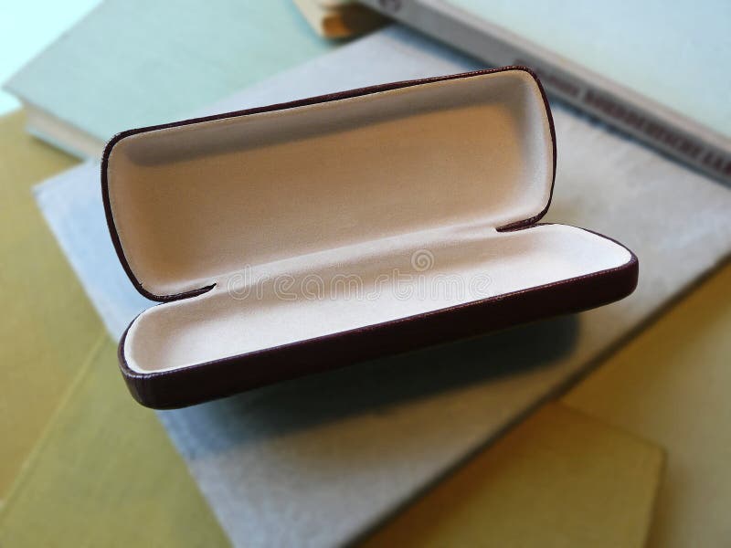Empty Spectacle Case on a Book Stack Stock Photo - Image of pile ...