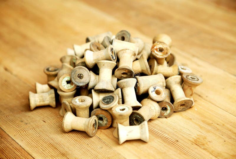 Empty Spools of Thread Sitting on a Table Stock Image - Image of ...