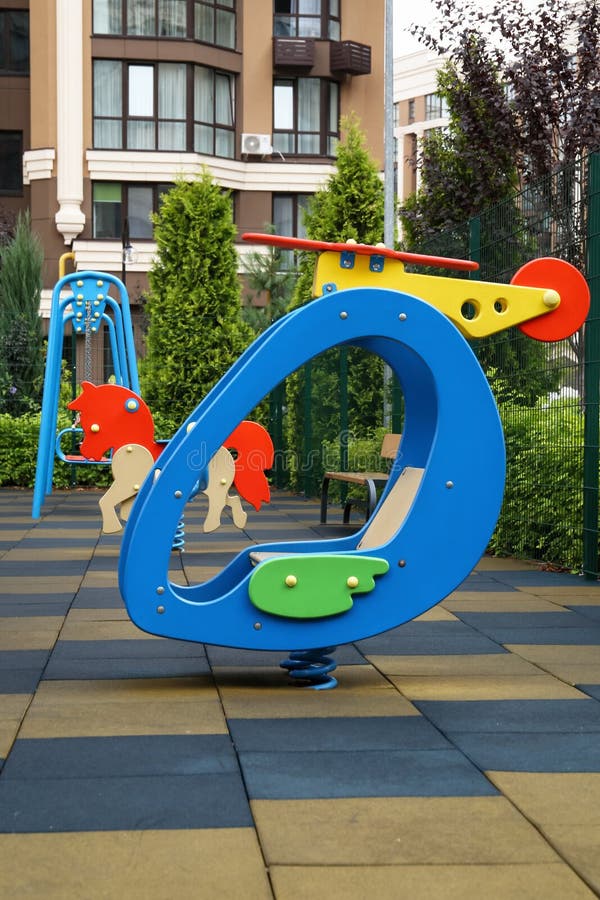 Children`s Playground with Bright Butterfly Shaped Spring Rider and ...