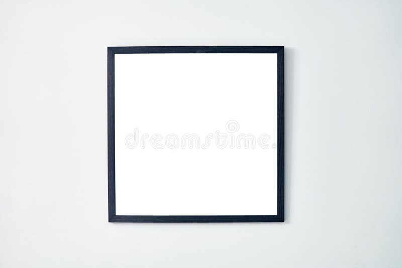 An Empty Square Photo Frame with a Black Border Hanging on a White Wall ...