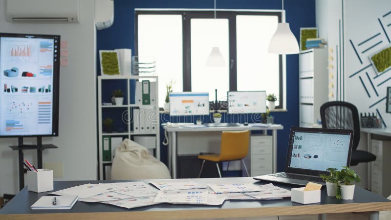Empty Startup Office with Laptop Showing Analytics on Display with ...